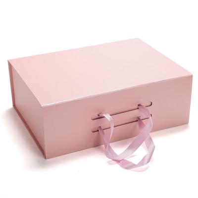 China Custom Clamshell Magnetic Foldable Packaging Box 300gsm Art Paper Rigid Cardboard Gift Box for sale