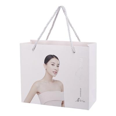 China Shopping Packaging Laminated C1S Art Paper Tote Bags Custom Logo for sale