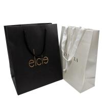 China Custom 300gsm Kraft Paper Gift Bag Full Color Printing with Handle for Clothing Packaging for sale