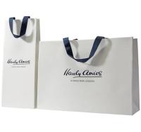 China Custom FSC Matte Printable Paper Bags 250gsm White Black Color for Garment Gift Packaging for sale
