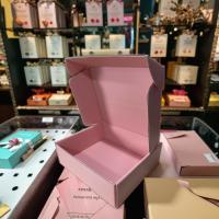China Custom Pink Glossy Lamination Gift Box for Cosmetics Corrugated Board with Matte Design and Shipping Logo Embossing Handling for sale