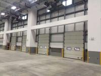 China Durable Industrial Sectional Overhead Door In Warehouses Loading Docks Distribution Centers for sale