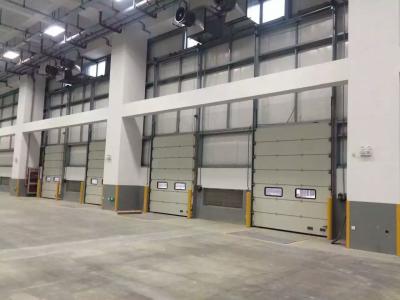 China Durable Industrial Sectional Overhead Door In Warehouses Loading Docks Distribution Centers for sale