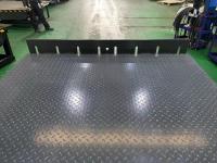China 10000KG Load Roll Off Truck Dock Leveler With Safety Barrier for sale