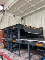 China 10000KG Load Roll Off Truck Dock Leveler With Safety Barrier for sale