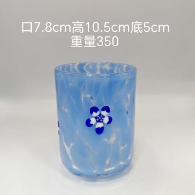 China Light Blue Twisted Glass Tumbler 7.8 cm Rim 10.5 cm Tall 350 g with Floral Applique Decor for sale
