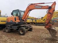China Second Hand DX60W 6T 0.175m3 Doosan Wheeled Excavator for sale
