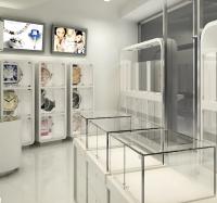 China Minimalist Microcement Cream Style LED Durable High End Custom Curved Jewelry Display Cases Stainless Steel Legs for Retail for sale