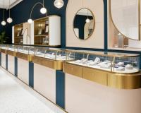 China Straight Modular Jewelry Display Counter | Pink Navy Blue Gold Metal Edging | Arc Middle Island Counter Built-in Retail Store for sale