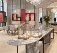 China Luxury Jewelry Display Table | Calacatta Marble Top Aluminium Frame | Gold Glass Showcase Built-in LED Lights for Retail Stores for sale