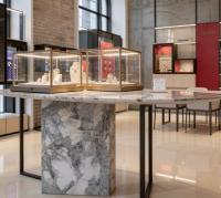China Luxury Jewelry Display Table | Calacatta Marble Top Aluminium Frame | Gold Glass Showcase Built-in LED Lights for Retail Stores for sale