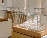 China Customizable LED Lit Tiered Display Counter with Durable Oak Finish for Jewelry Shop for sale