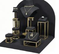 China Luxury Black Velvet Gold Metal Jewelry Display Stand Set Complete Turnkey Package LED Lit Eco-Friendly Multi-Height Stands for sale