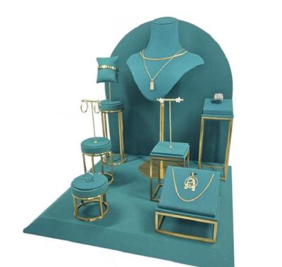 China Luxury Teal Velvet Rose Gold Jewelry Display Stand Set Complete Turnkey Package Eco-Friendly Durable Multi-Height LED Lit for sale