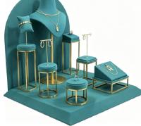 China Luxury Teal Velvet Rose Gold Jewelry Display Stand Set Complete Turnkey Package Eco-Friendly Durable Multi-Height LED Lit for sale