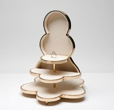 China Custom Luxury Rotating Jewelry Display Case, Premium Gold Frame Velvet Display Stand for Engagement Ring for sale