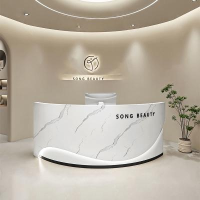 China Reception Desk with Marble-effect Veneer Premium Cashier Counter with LED Ambient Lighting for Jewelry Shop Counter for sale