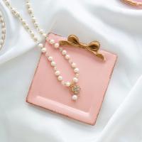 China Gold Plated Metal Jewelry Display Stand Luxury Props for Diamond Gemstone Jewelry for sale