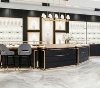 China Custom Luxury Jewelry Shop Solution, Sleek Black & Gold Showcase with Integrated LED Lighting & Chandelier for sale