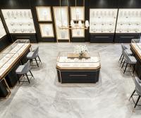 China Custom Luxury Jewelry Shop Solution, Sleek Black & Gold Showcase with Integrated LED Lighting & Chandelier for sale
