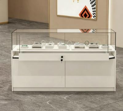 China Modern Minimalist White Glass Jewelry Display Counter, Lockable Retail Showcase with Storage Drawers for sale