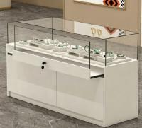China Modern Minimalist White Glass Jewelry Display Counter, Lockable Retail Showcase with Storage Drawers for sale