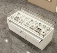 China Modern Minimalist White Glass Jewelry Display Counter, Lockable Retail Showcase with Storage Drawers for sale