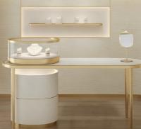 China Luxury Oval Jewelry Display Table with Round Glass Showcase & Gold Trim LED Lighting for High-End Boutique for sale