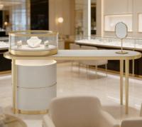 China Luxury Oval Jewelry Display Table with Round Glass Showcase & Gold Trim LED Lighting for High-End Boutique for sale