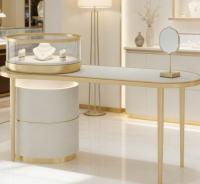 China Luxury Oval Jewelry Display Table with Round Glass Showcase & Gold Trim LED Lighting for High-End Boutique for sale