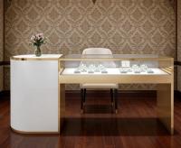 China Modern L-Shape Jewelry Display Table LED Lighting White Curved Cabinet Gold Metal Frame Glass Showcase for High-End Retail Store for sale