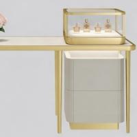 China Luxury Gold Jewelry Display Table with Removable Glass Showcase & Storage Drawer LED Lighting for Showroom & Retail Store Use for sale