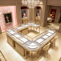 China Luxury Champagne Gold LED Eco-Friendly Jewelry Store Interior Design Complete Turnkey Fixture Package U-Shaped Central Showcase for sale