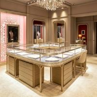 China Luxury Champagne Gold LED Eco-Friendly Jewelry Store Interior Design Complete Turnkey Fixture Package U-Shaped Central Showcase for sale