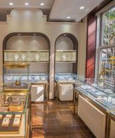 China Custom Jewelry Display Counter   Stainless Steel Frame Tempered Glass LED Light Jewellery Showcase for Luxury  Jewelry Boutique for sale