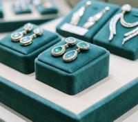 China Luxury Octagonal Glass Jewelry Display Counter, Modern Retail Showcase with Teal Velvet Inserts & LED Lighting for sale