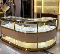 China Custom Curved Jewelry Display Cabinet Set | Cream Gold Finish | Middle Island Counter + Wall Mounted Showcase | LED Lit Durable for sale