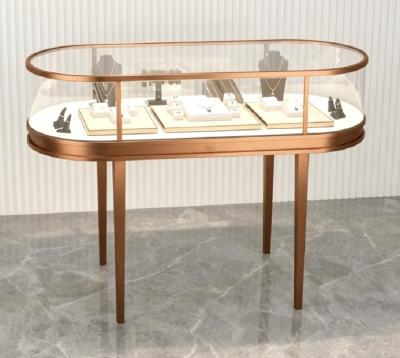 China Luxury Rose Gold Oval Jewelry Display Case, Premium Glass Jewelry Showcase for High-End Jewelry Stores for sale
