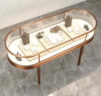 China Luxury Rose Gold Oval Jewelry Display Case, Premium Glass Jewelry Showcase for High-End Jewelry Stores for sale