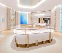 China Luxury White & Gold Curved Jewelry Display Island, Premium Glass Jewelry Showcase for High-End Jewelry Stores for sale