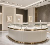 China Curved Island Customizable Jewelry Display Counter | Cream Body with Gold Trim | Glass Showcase LED Lights for Retail Store Mall for sale