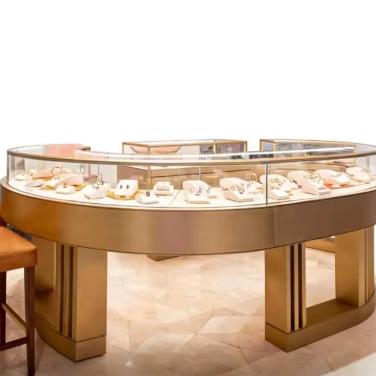 China Luxury Gold Metal Frame Jewelry Display Case with Tempered Glass Top and LED Lit for Retail Store for sale
