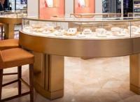 China Luxury Gold Metal Frame Jewelry Display Case with Tempered Glass Top and LED Lit for Retail Store for sale
