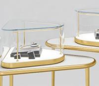 China Luxury Irregular Shape Jewelry Display Table with Gold Frame and LED Lighting Premium Curved Glass Showcase for sale