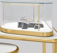 China Luxury Irregular Shape Jewelry Display Table with Gold Frame and LED Lighting Premium Curved Glass Showcase for sale