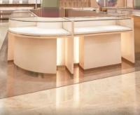 China Luxury Warm Apricot Curved Jewelry Display Cases High End Custom Glass Showcases with LED Lighted Base for Showroom for sale
