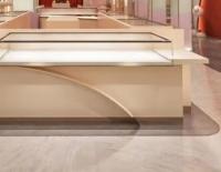 China Luxury Warm Apricot Curved Jewelry Display Cases High End Custom Glass Showcases with LED Lighted Base for Showroom for sale