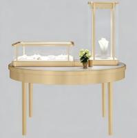 China Luxury Table Glass Jewelry Display Case Gold Metal Frame LED Tall Tower Showcase Retail Showroom Display for Rings Necklaces for sale