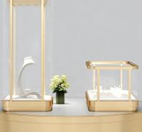 China Luxury Table Glass Jewelry Display Case Gold Metal Frame LED Tall Tower Showcase Retail Showroom Display for Rings Necklaces for sale