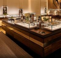 China Wabi-Sabi Dark Walnut Natural Texture LED Jewelry Display Cases High End Custom Glass Showcases Solid Wood Base Retail Store for sale